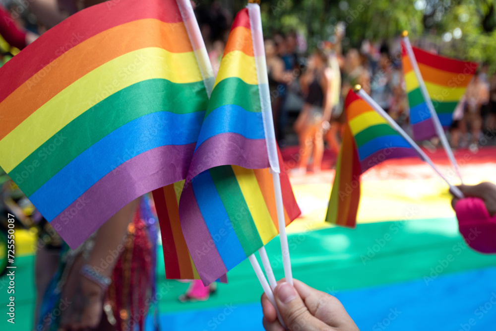 Rainbow flags welcome the on coming Pride parade, selective focus ...