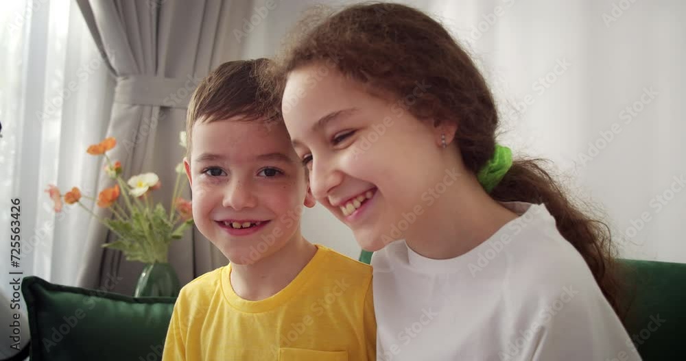 Pretty smiling child daughter embrace brother look at camera. Happy ...