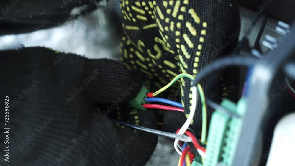 Electrician installs wiring using Connectors for connecting wires in ...