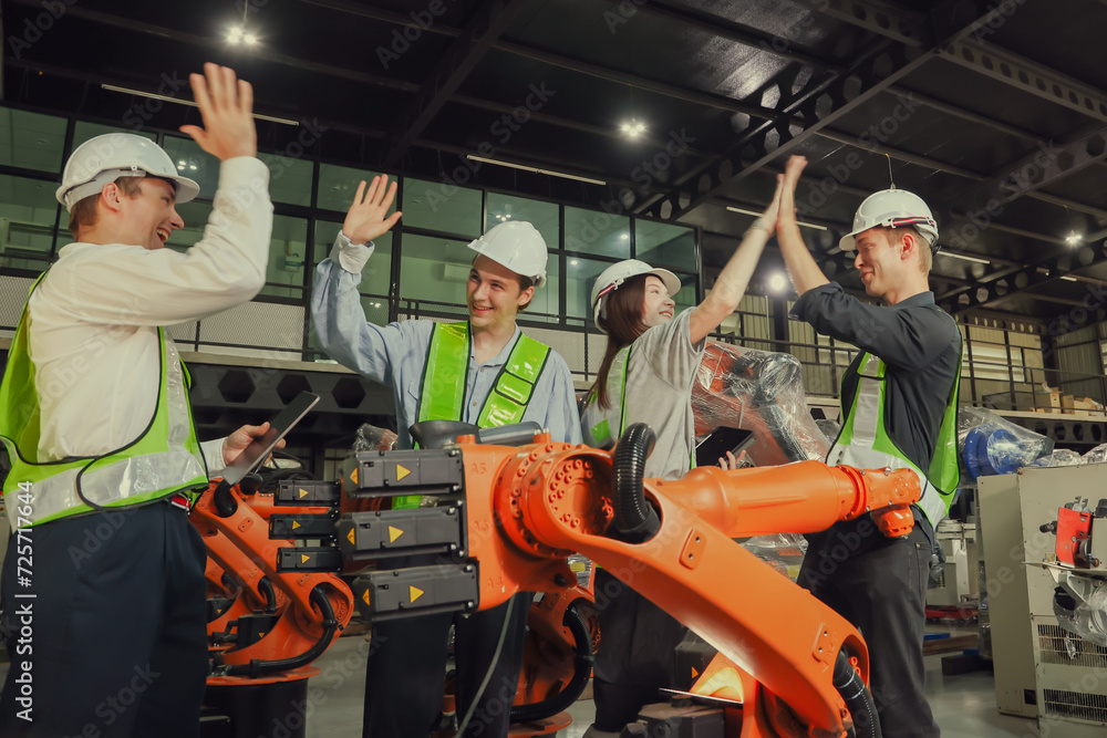 Teamwork engineers robots electricians men and women brainstormed ...