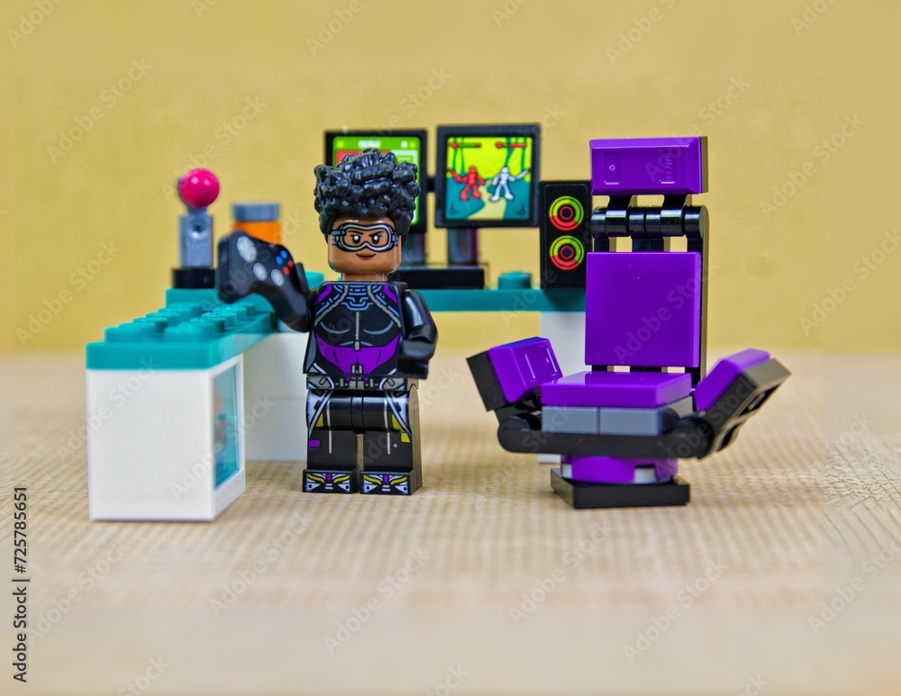 Toy, smiling gamer mini figures having fun with computer screens ...