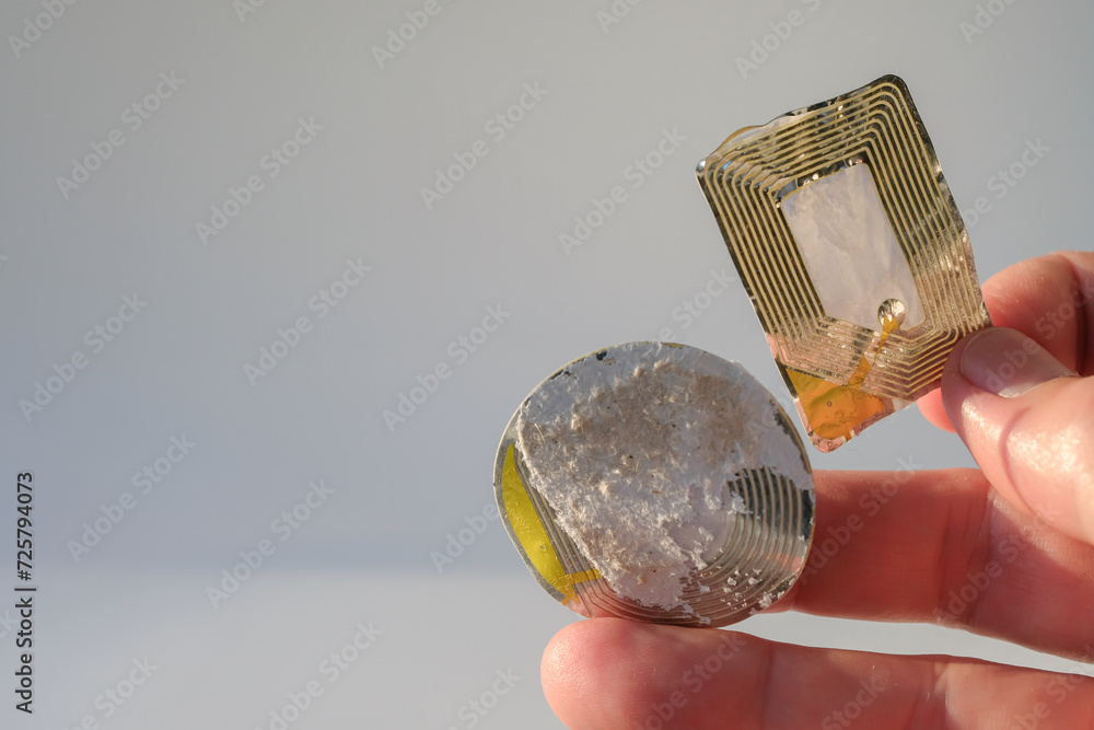 The used radio frequency security labels are in the hand. Stock Photo ...