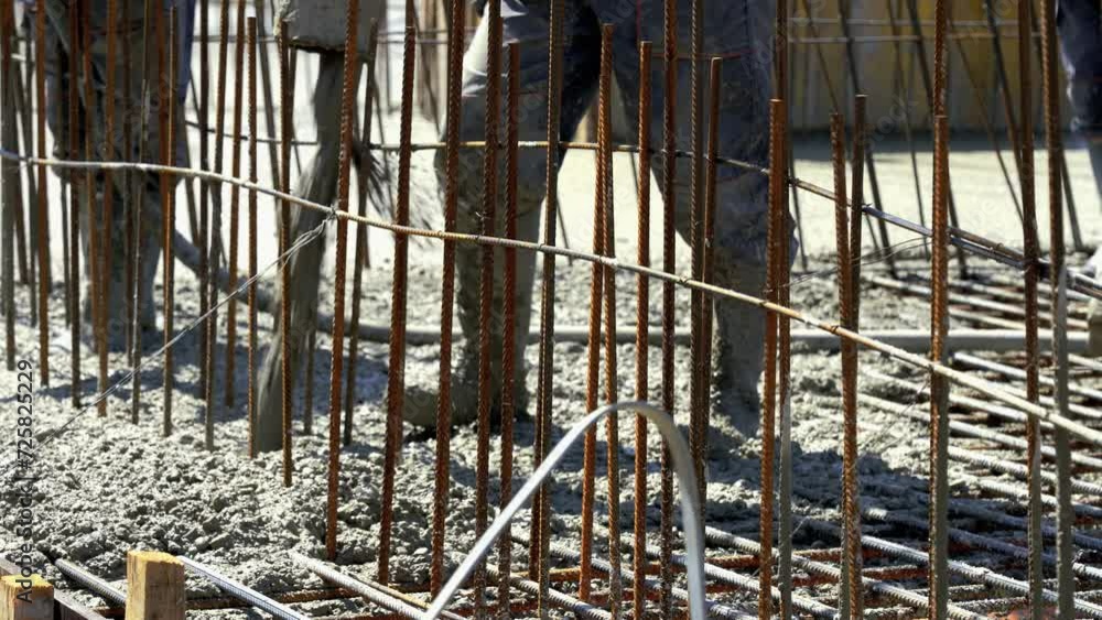 Construction Worker Pouring Concrete with Pump Tube. High Rise Concrete ...