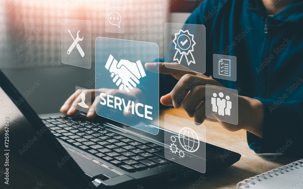 Technical support operator with virtual screen icon working on laptop ...