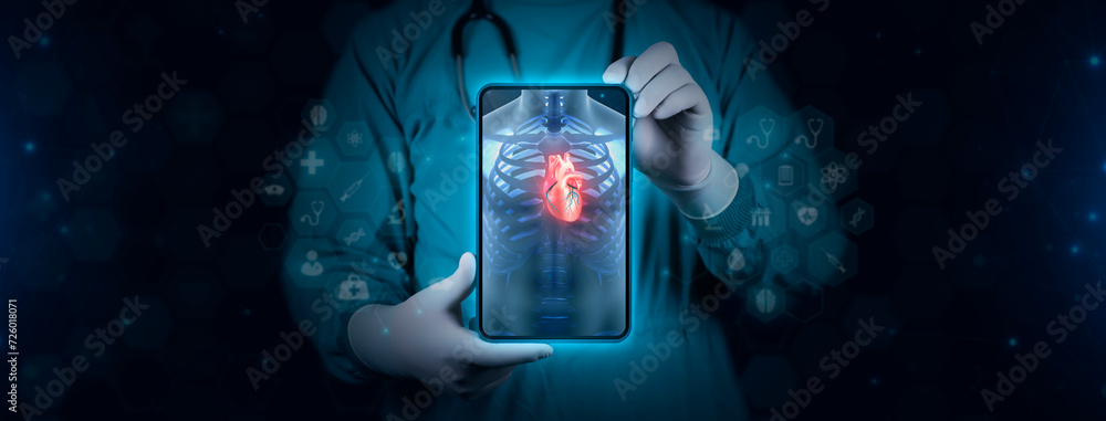 The doctor analyzes the cardiac angiography. Doctor with tablet shows ...