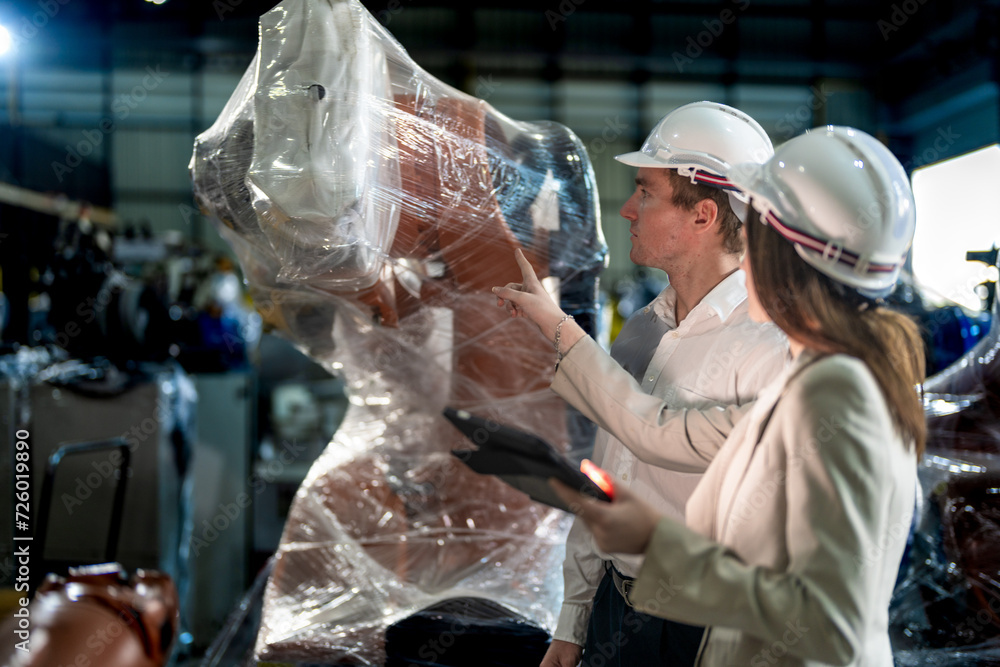 Sales manager and factory owner in suits negotiating selling robots ...