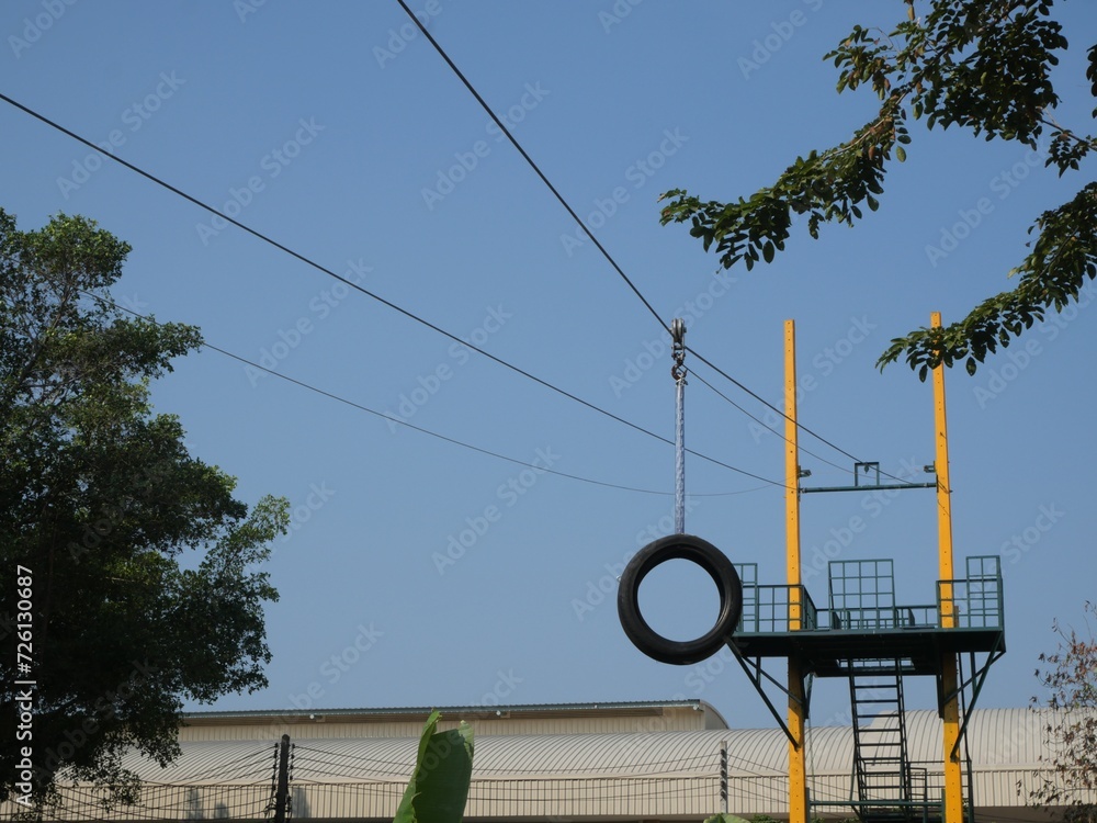 Local Zipline made from car tire and wire rope installed in urban ...