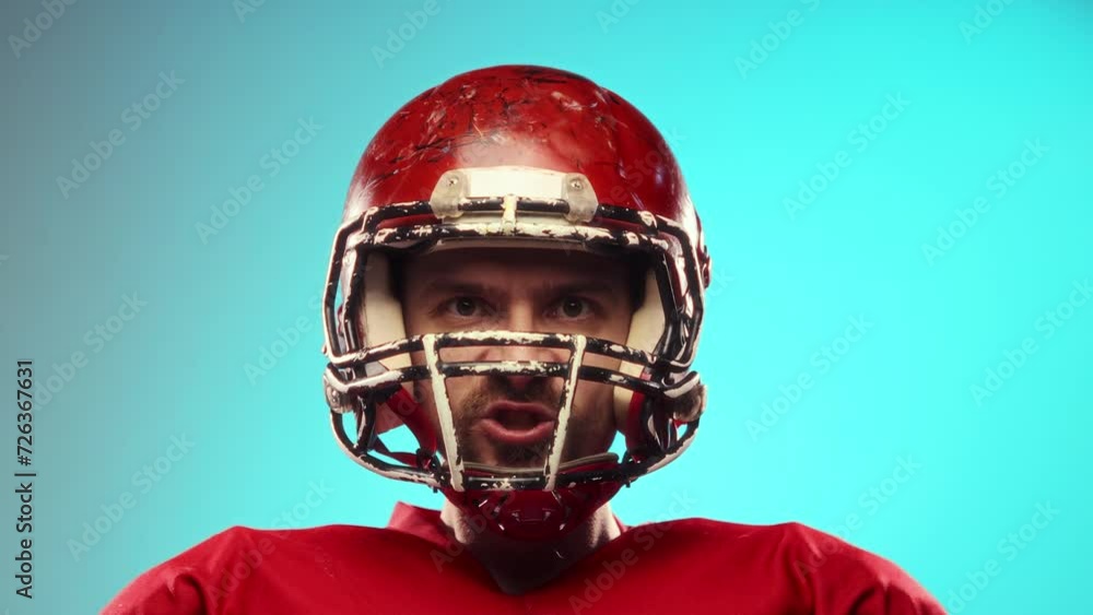Anger and motivation to win. American football player in helmet and ...