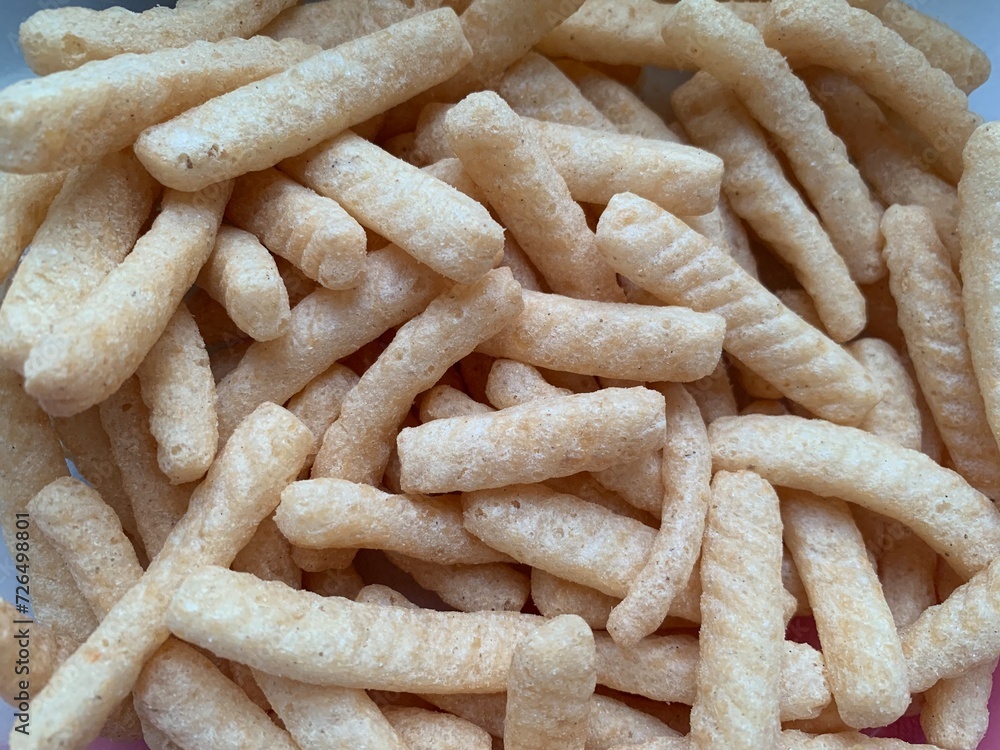 Pile of crunchy shrimp sticks as background. Close up, Crackers, snacks ...