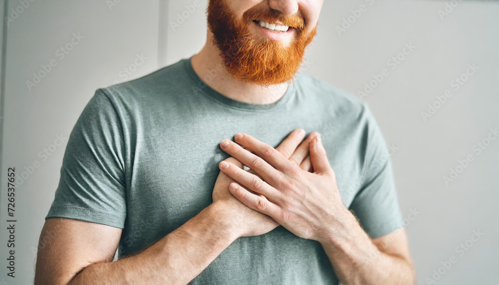 hand over chest, depicting heart attack pain, against a clean ...