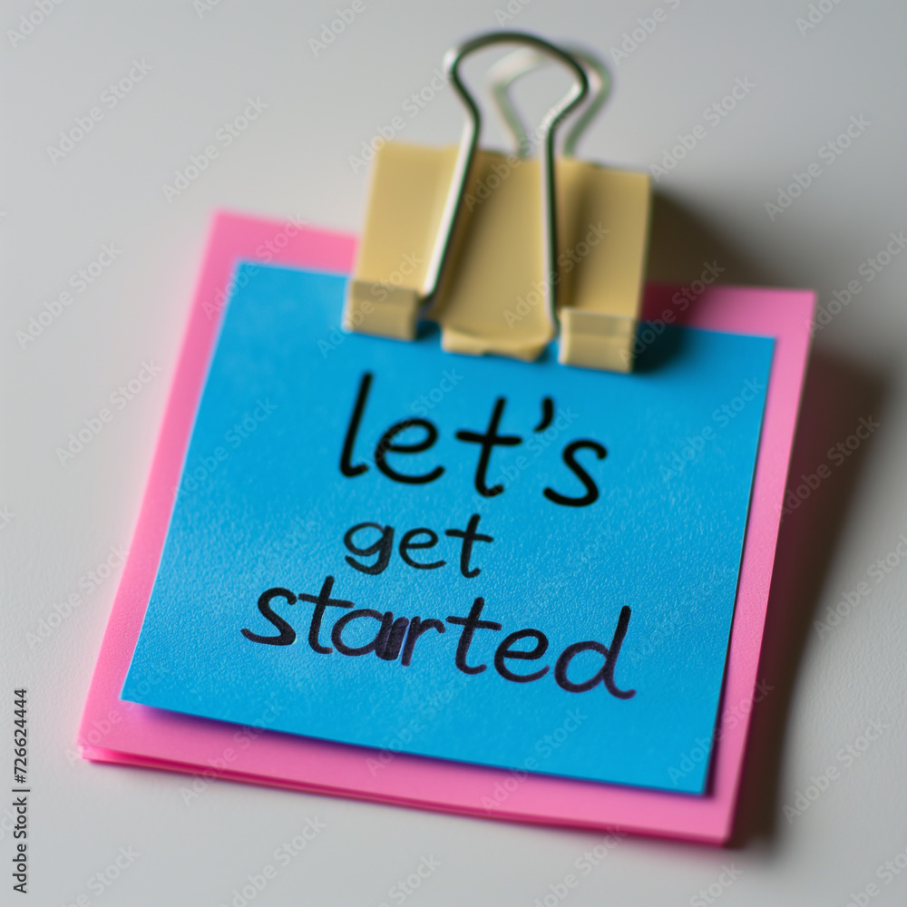 A close-up image captures a bright blue sticky note with the ...