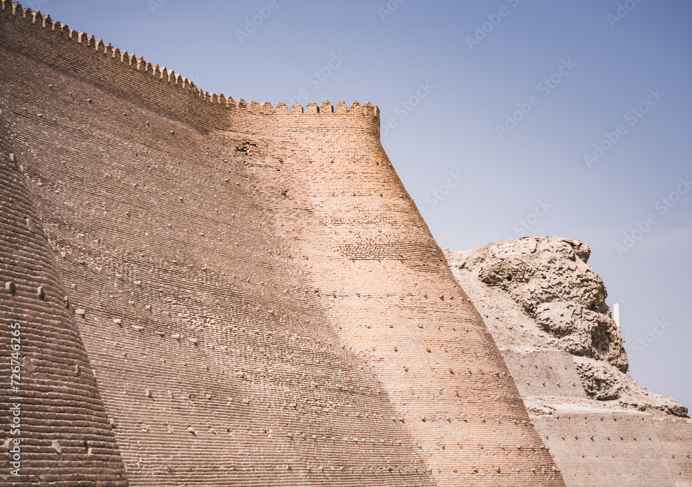 Ark Citadel with brick fortress walls in the ancient city of Bukhara in ...