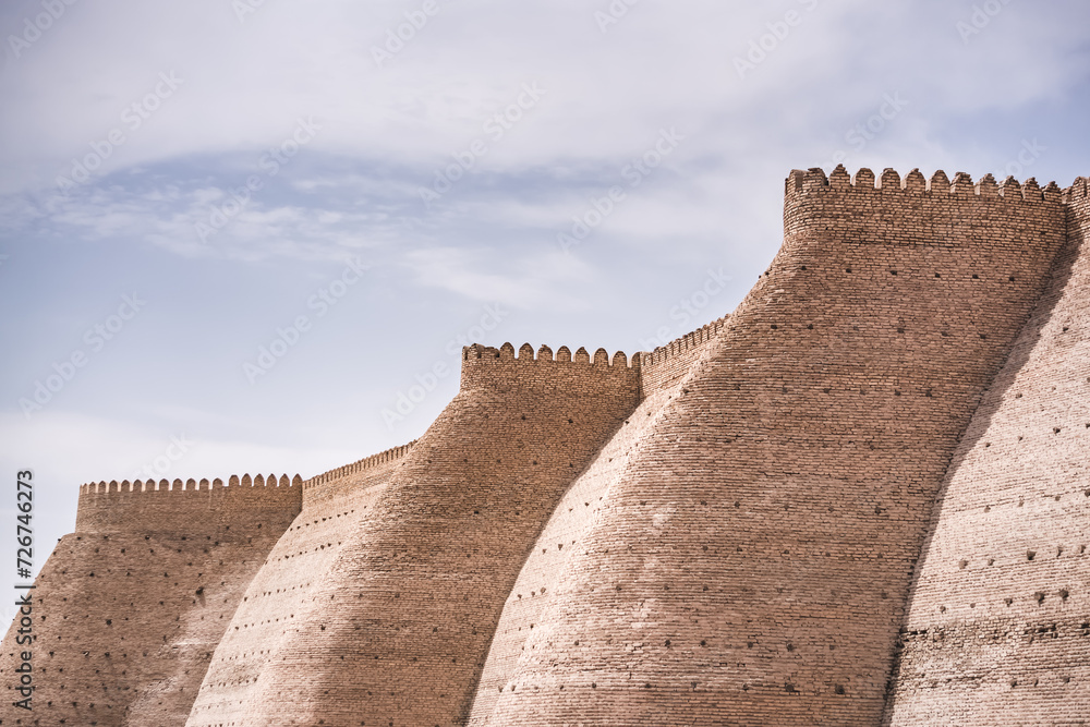 Ark Citadel with brick fortress walls in the ancient city of Bukhara in ...