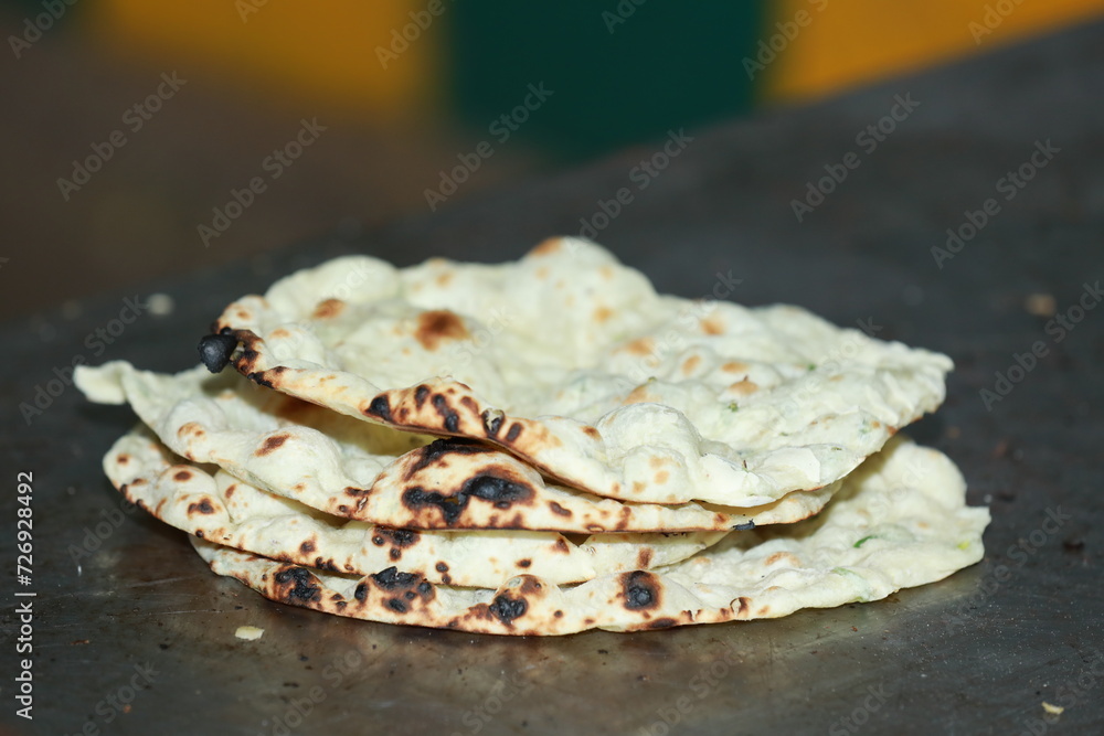 preparation of food in indian kitchen- roti, nan, paratha an indian ...