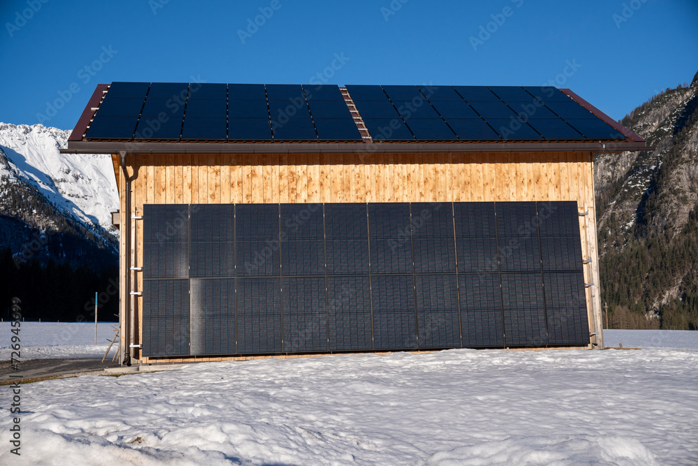 Photovoltaic system with roof and wall panels to cover the building's ...