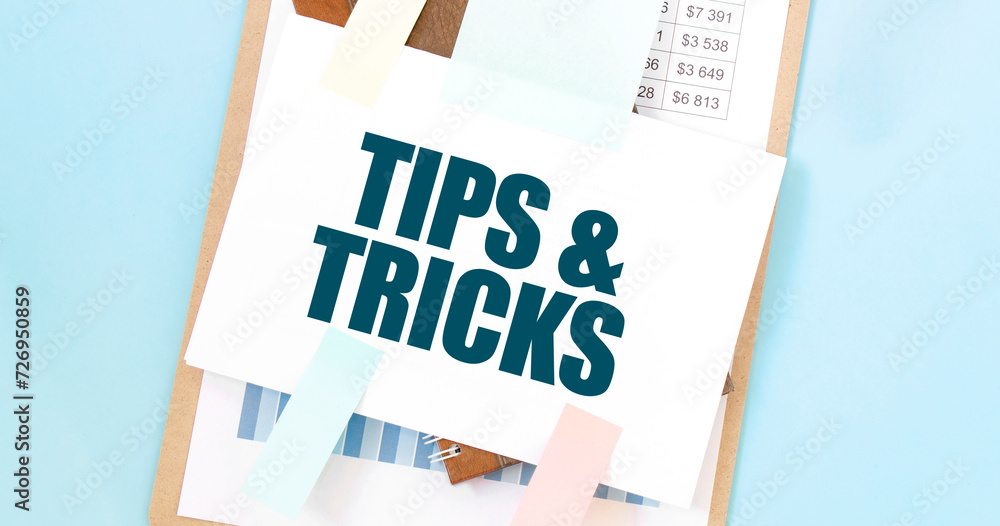 Paper plate with text take TIPS AND TRICKS. Diagram, notepad and blue ...