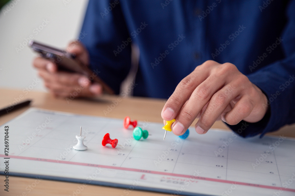Calendar concept , Businessman manages time for effective work ...