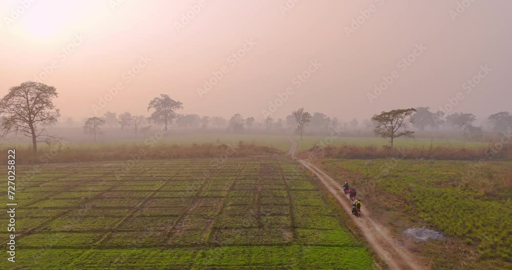 Terai region Nepal traveling trails drone shot three motorbike riders ...