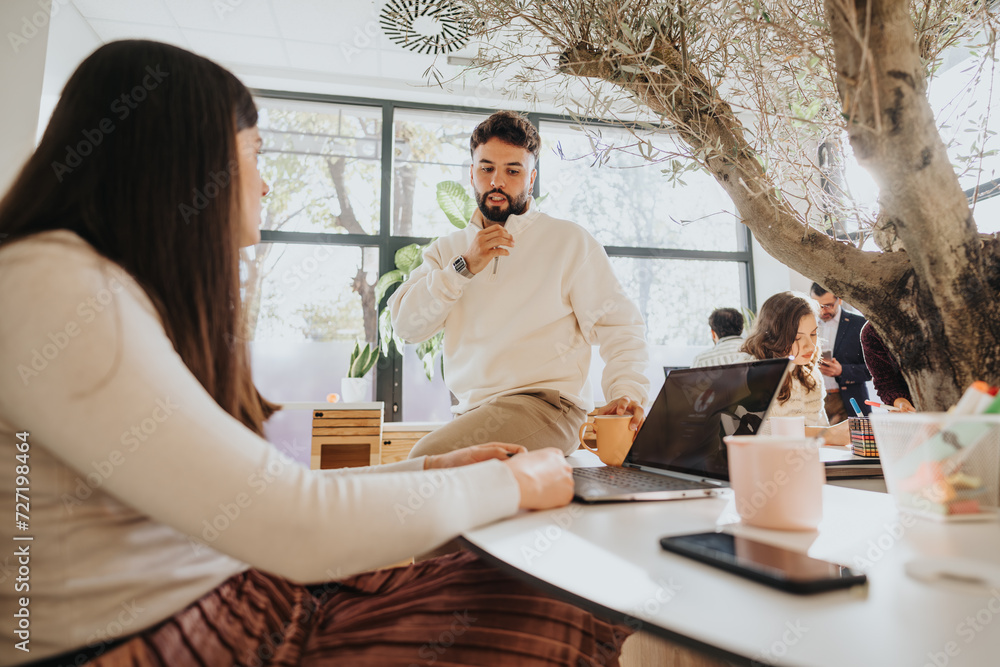 Business employees collaborating in a corporate office on business ...