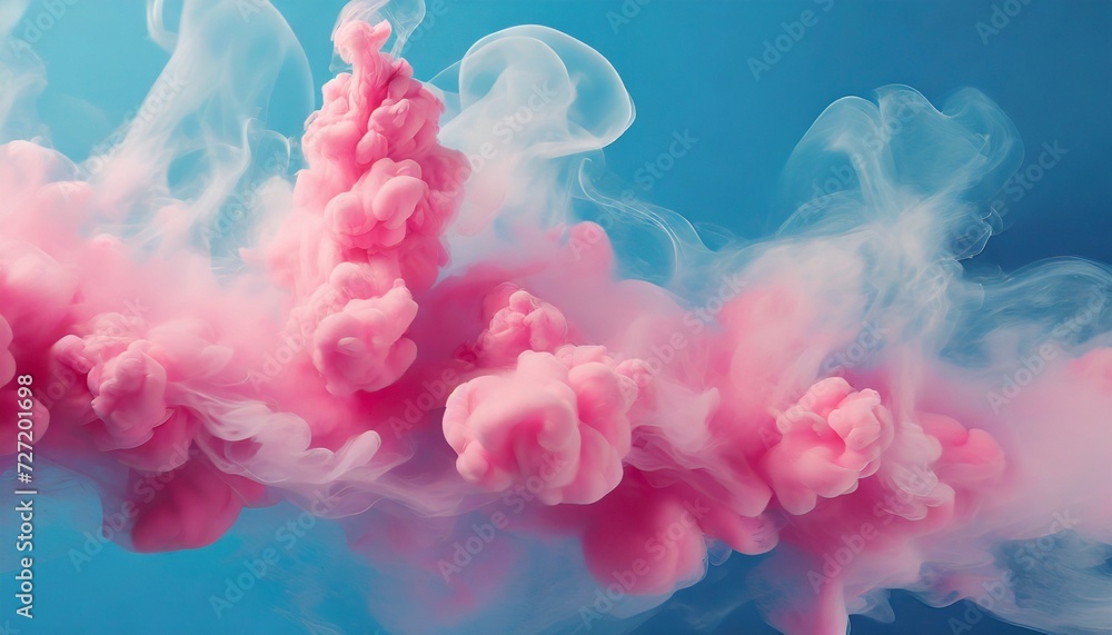 puffs of pink smoke in front of a blue background stock photo in the ...