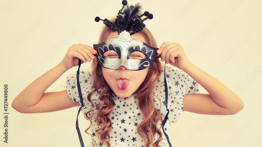 Child in a carnival masquerade mask. Festival, carnival, party. A ...
