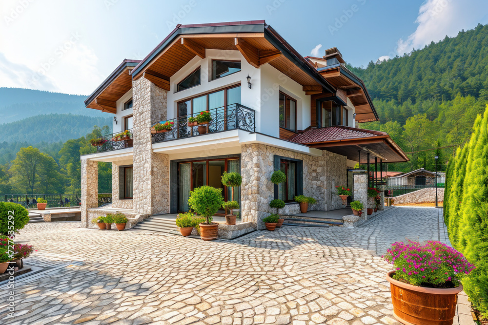 Luxury mountain house with beautiful landscaping on sunny day ...