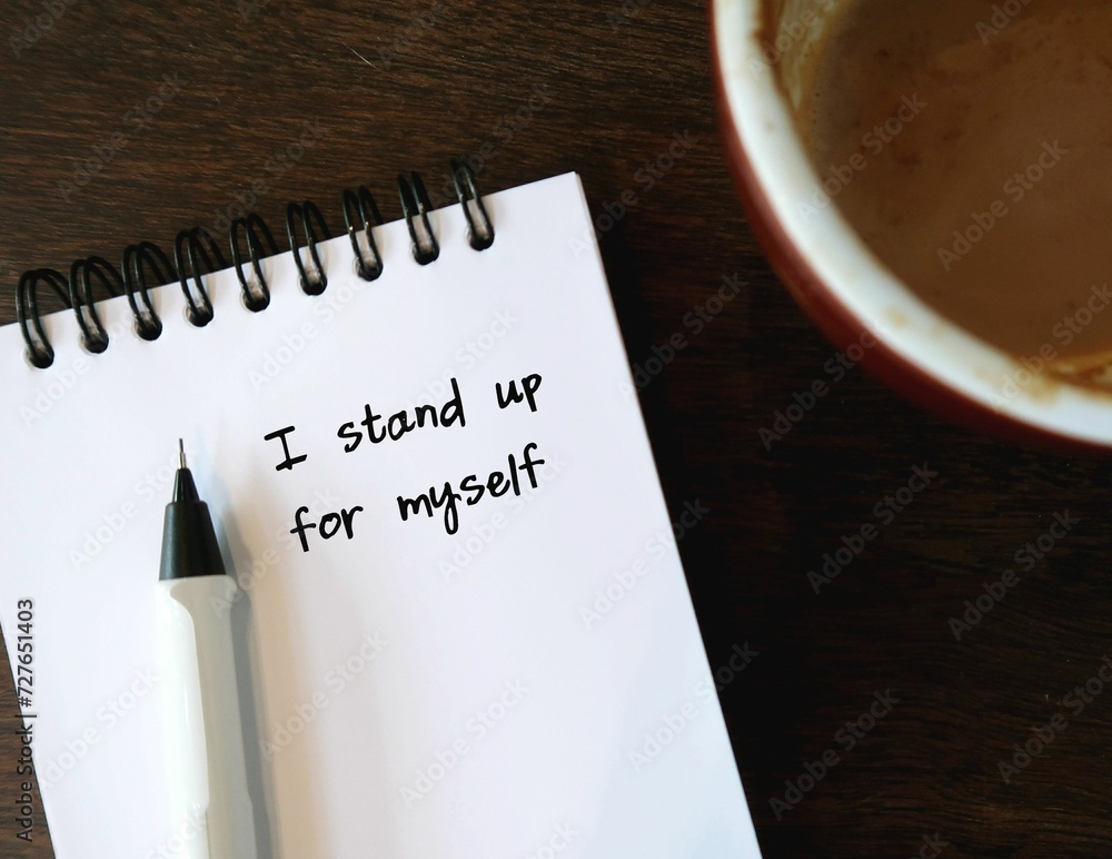 Notebook with handwritten text I STAND UP FOR MYSELF, positive daily ...