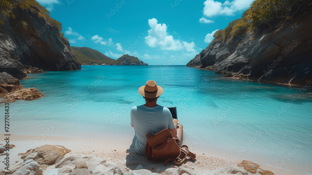 Digital nomad with a hat working remotely with her laptop from a paradise beach. Digital ...