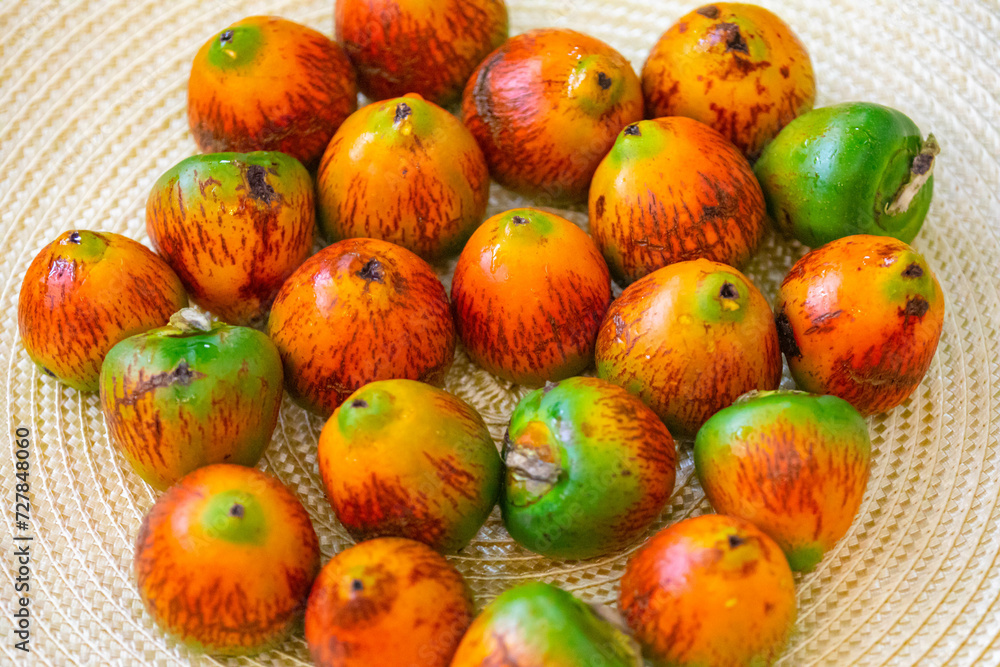 Rare and exotic fruit of the peach palm (Bactris gasipaes), typical ...