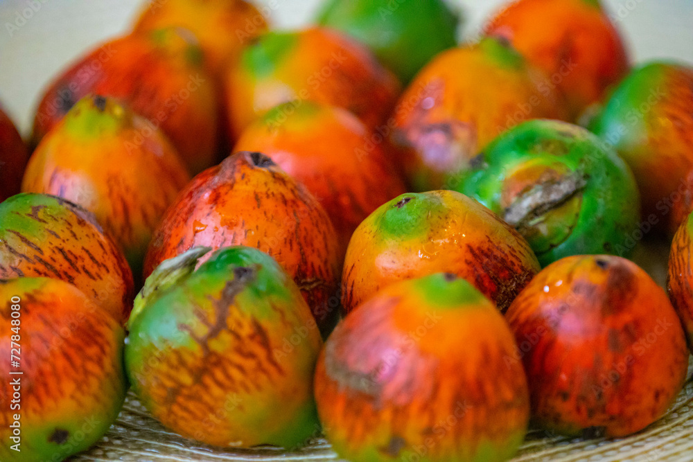 Rare and exotic fruit of the peach palm (Bactris gasipaes), typical ...