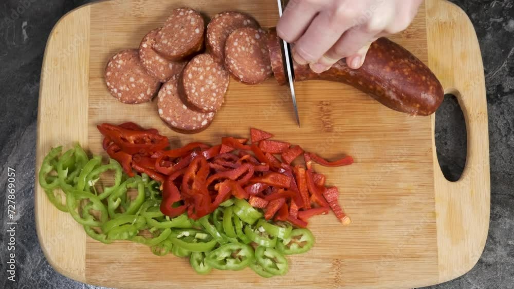 Vidéo Stock Slicing Turkish Sausage Also Known as Sucuk in Pan. Cutting ...