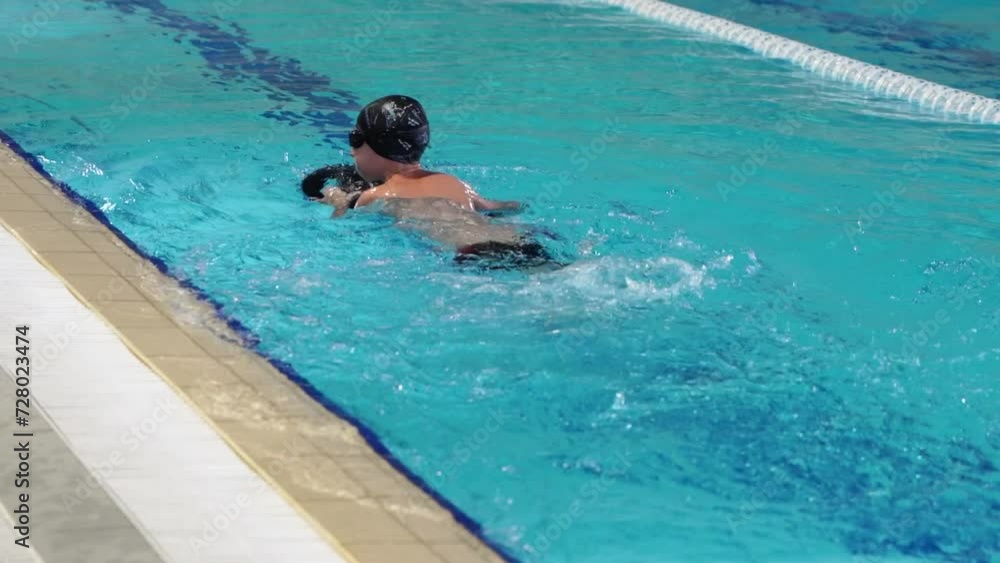 swimming pool training lesson for kids. little boy child learning to ...