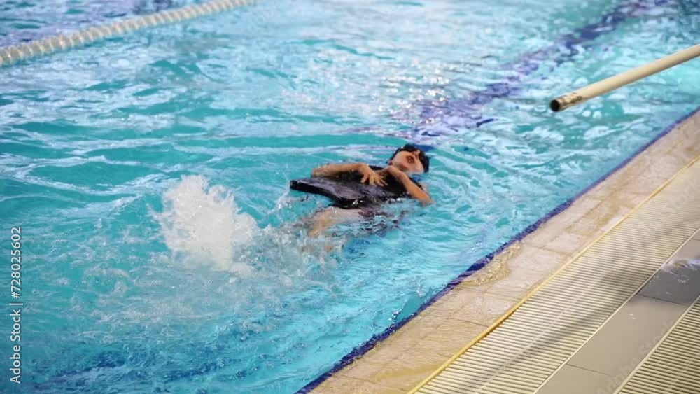 swimming pool training lesson for kids. little boy child learning to ...