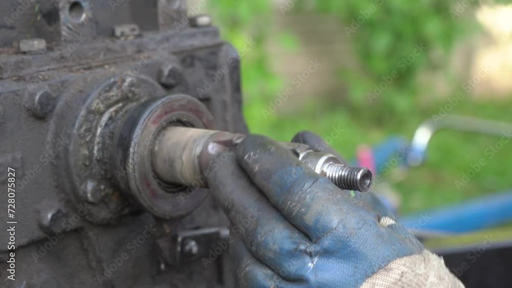 shaft in the gearbox, gearbox shaft, the locksmith turns the shaft in ...