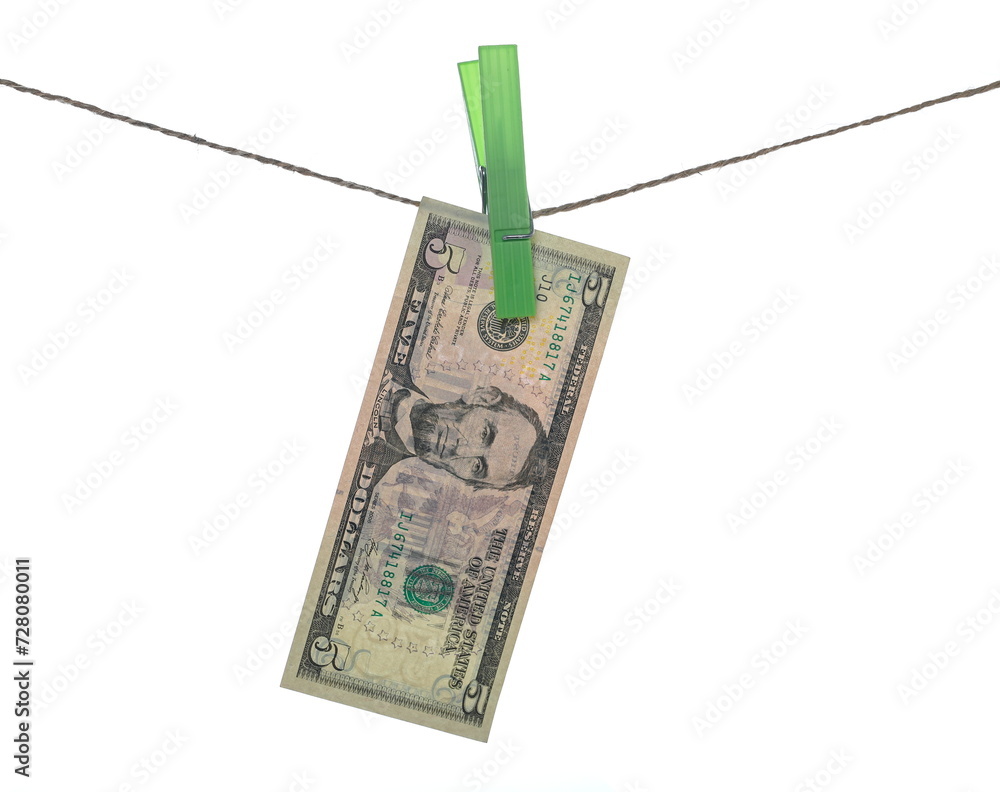 Five dollar bill, banknote dry hanging on clothesline string with a ...