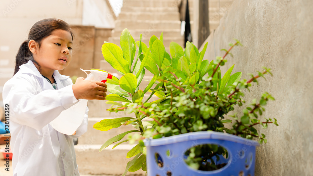 Little Latina girl in a white robe, watering and observing plants ...