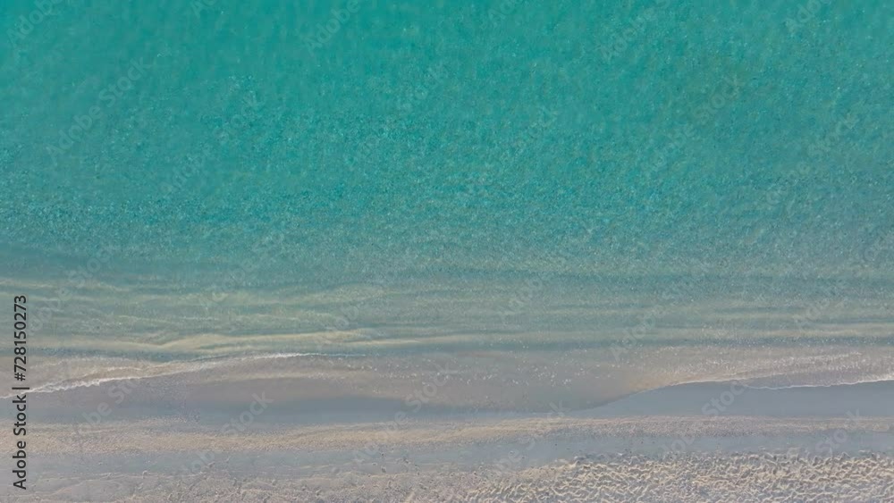 Vidéo Stock Drone captures a crystal clear top-down view of the sea and ...