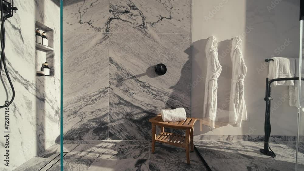 wide push in inside of a luxury shower with white granite, a wooden ...