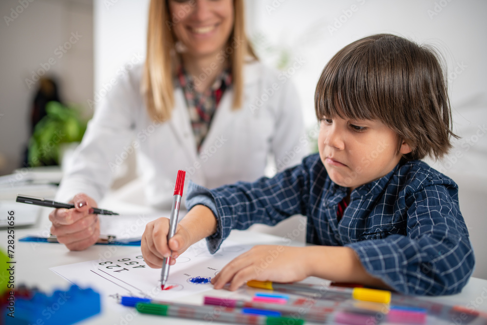 Early cognitive development as toddler engage in a psychology test ...