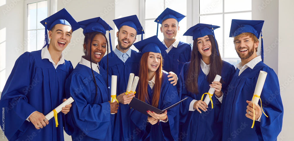 Group portrait of students graduation ceremony, happy young diverse ...