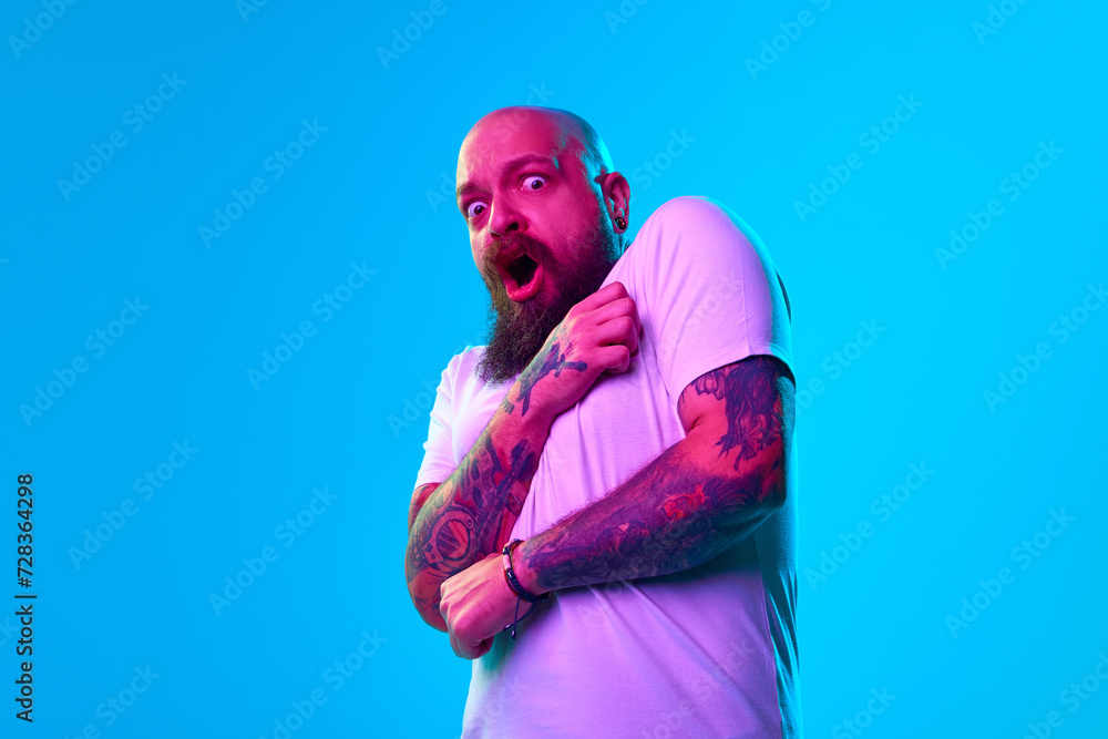 Portrait of emotional breaded bald man expressing fearful face ...