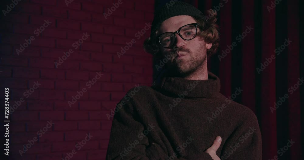 Portrait of a young guy seems confident and serious. Cool comedian ...