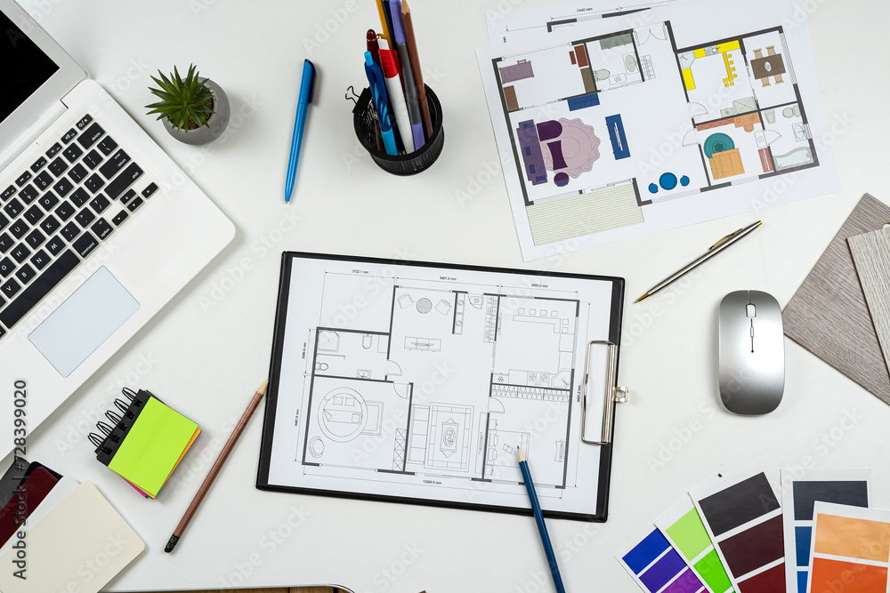 Architect's table with laptop, house plab blueprint and color wwoden ...