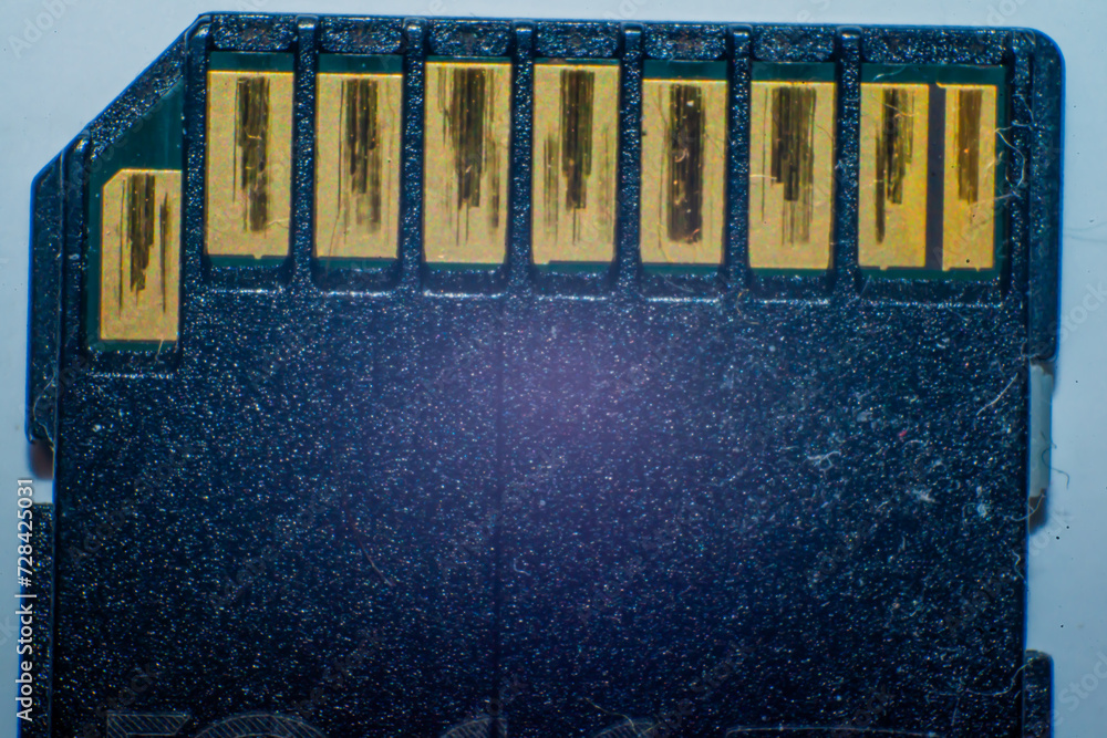 A detailed macro photo of an SD card, showcasing compact technology for ...