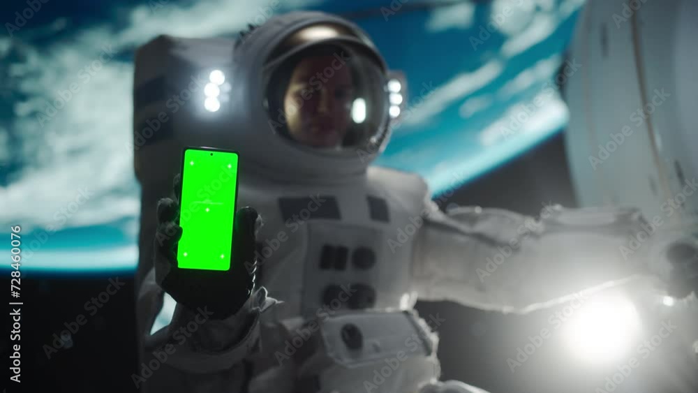 Young Astronaut Floating in Space in Zero Gravity. Spaceman Showing a ...