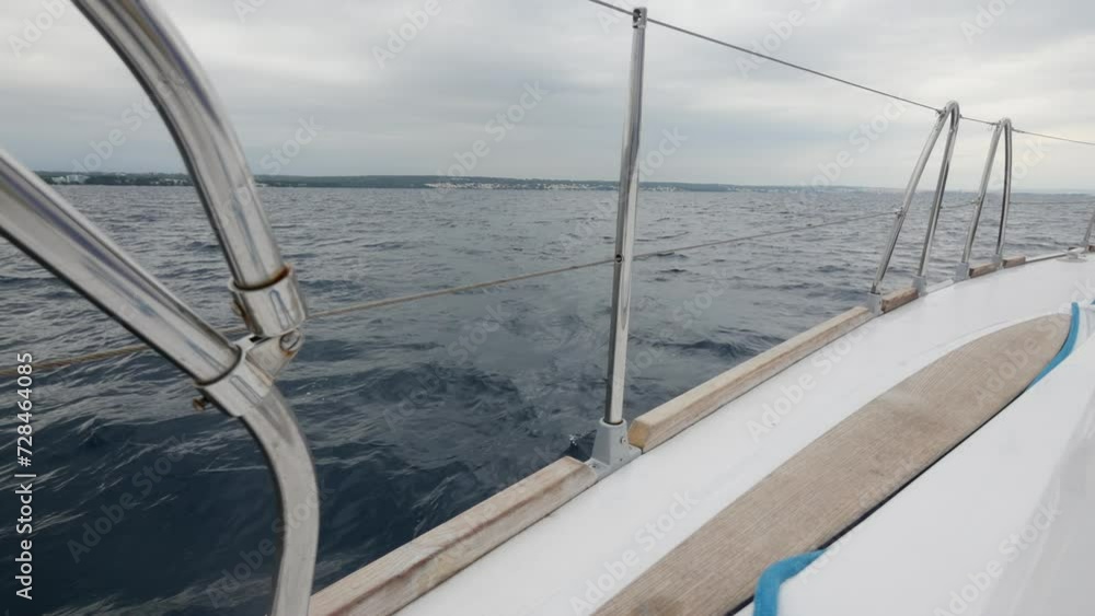 Railing fencing on deck of white yacht on background of water while ...