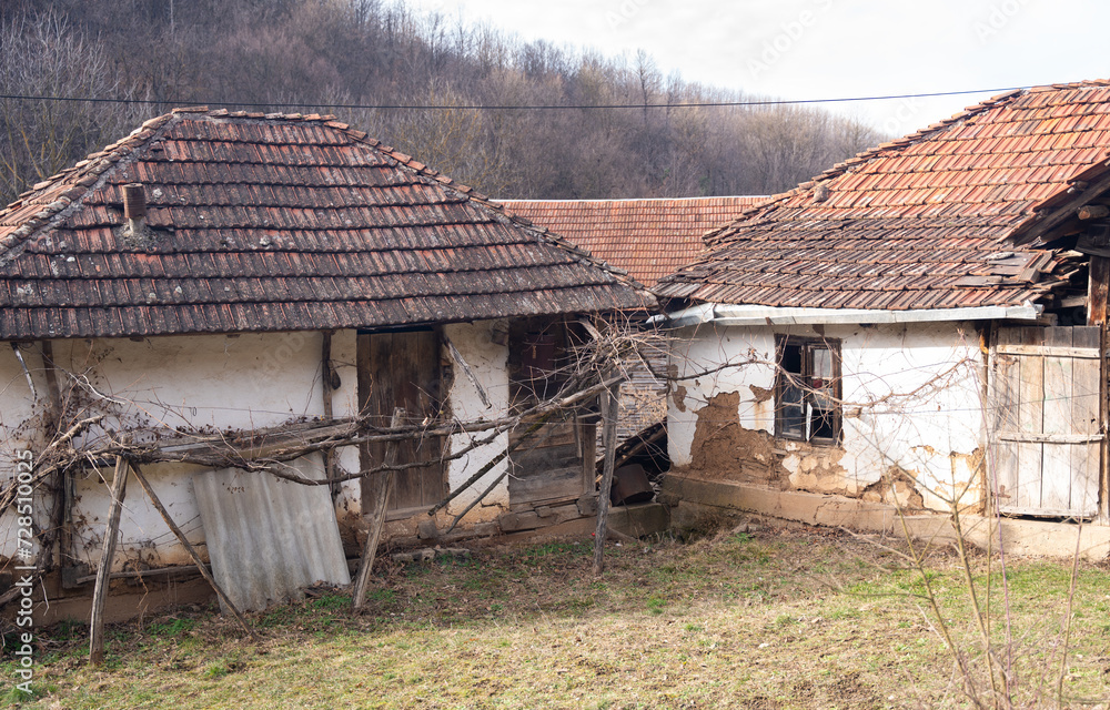 Old dilapidated houses in an abandoned mountain Serbian village in ...