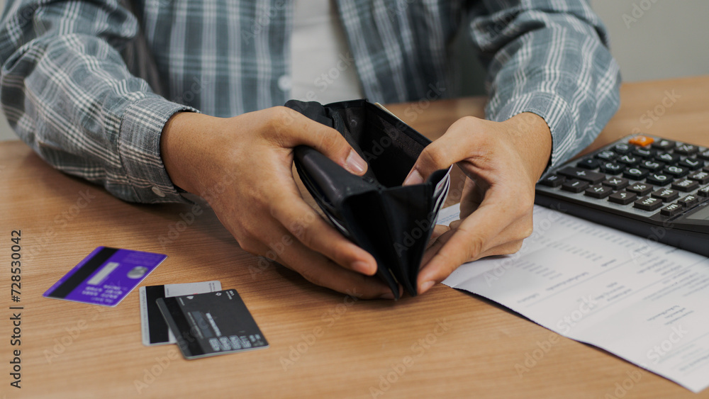 Poor man bankrupt with no credit in debt hand hold empty black leather ...