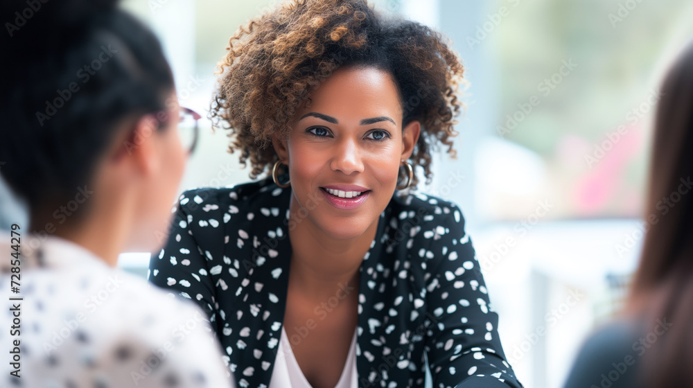 a woman mentoring others in an educational setting, highlighting the ...