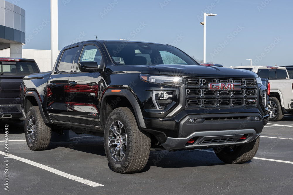GMC Canyon 4WD AT4 pickup display at a dealership. GMC offers the ...